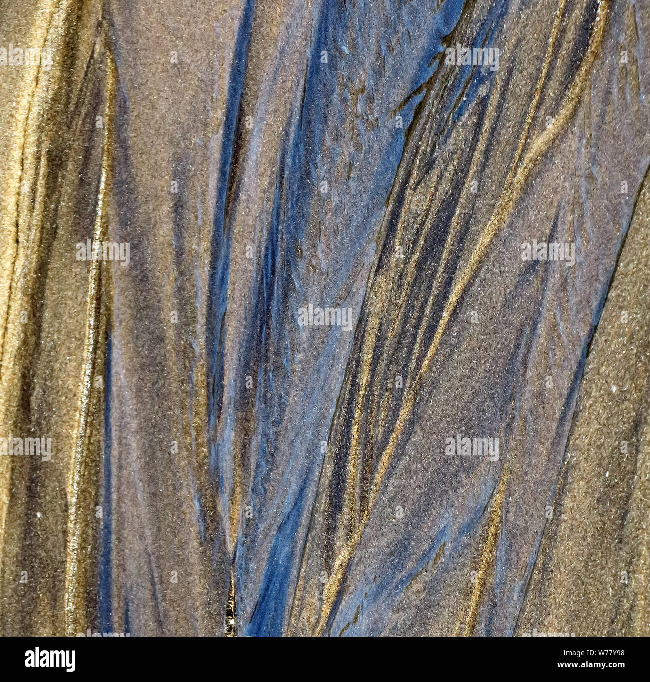 Abstract detailed tidal patterns in the sand at low tide on Penbryn ...