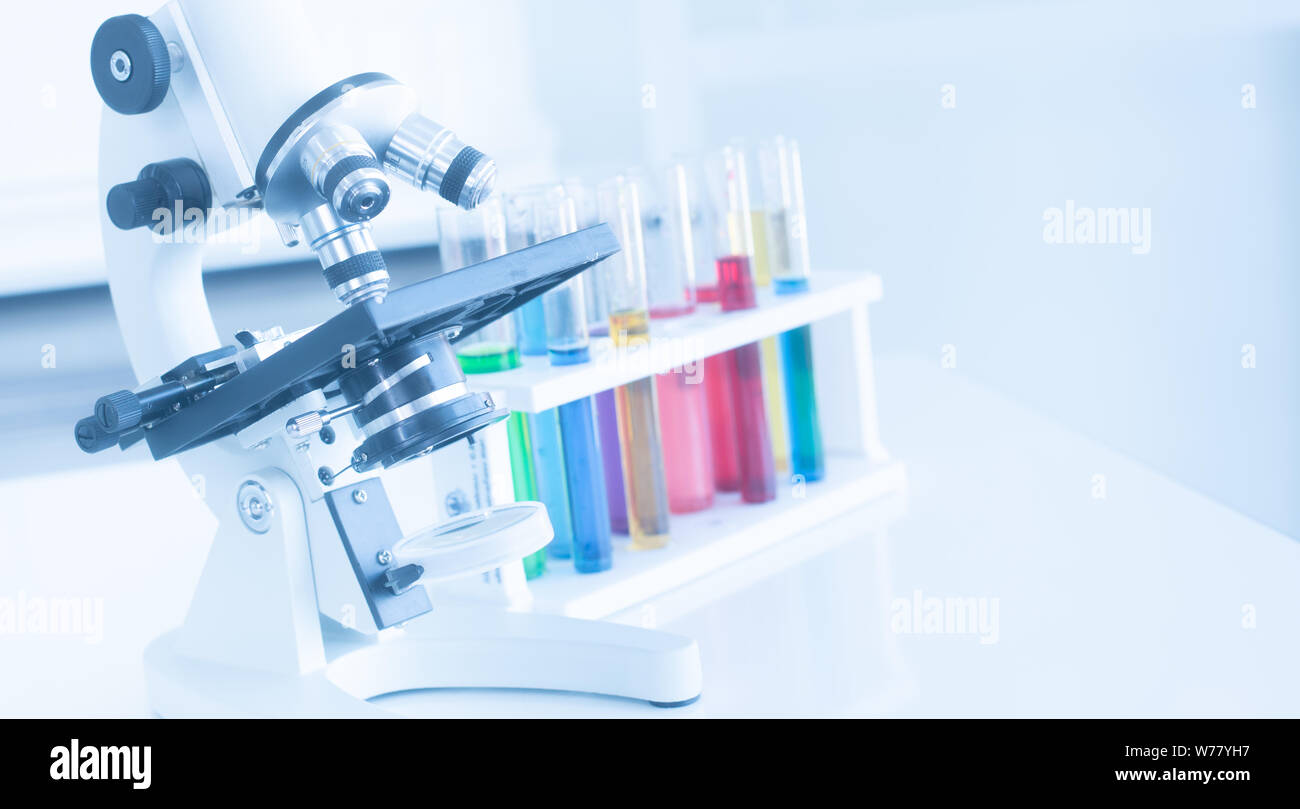 Microscope and glass tube in research laboratory concept Stock Photo ...