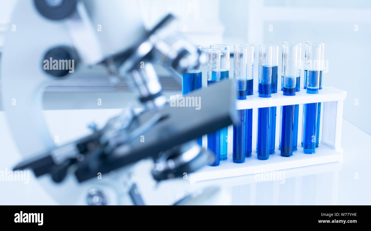 Microscope and glass tube in research laboratory concept Stock Photo ...