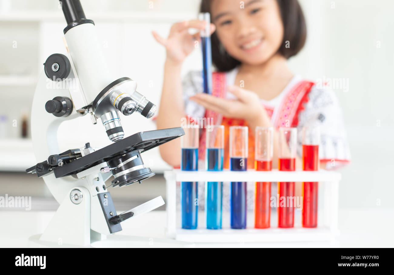 Asian kid learning scientific in laboratory Stock Photo - Alamy