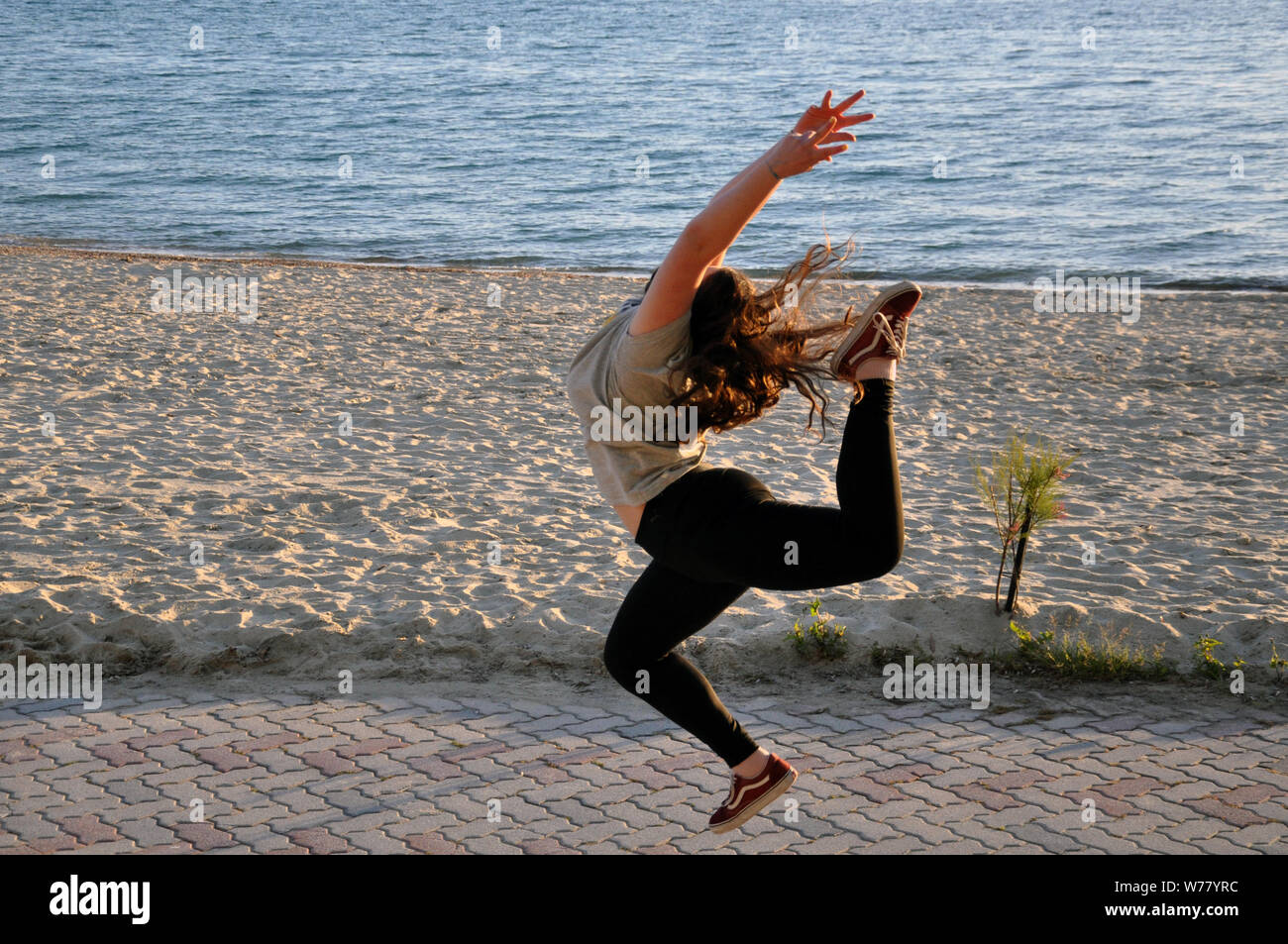 Jumping on the beach hi-res stock photography and images - Alamy