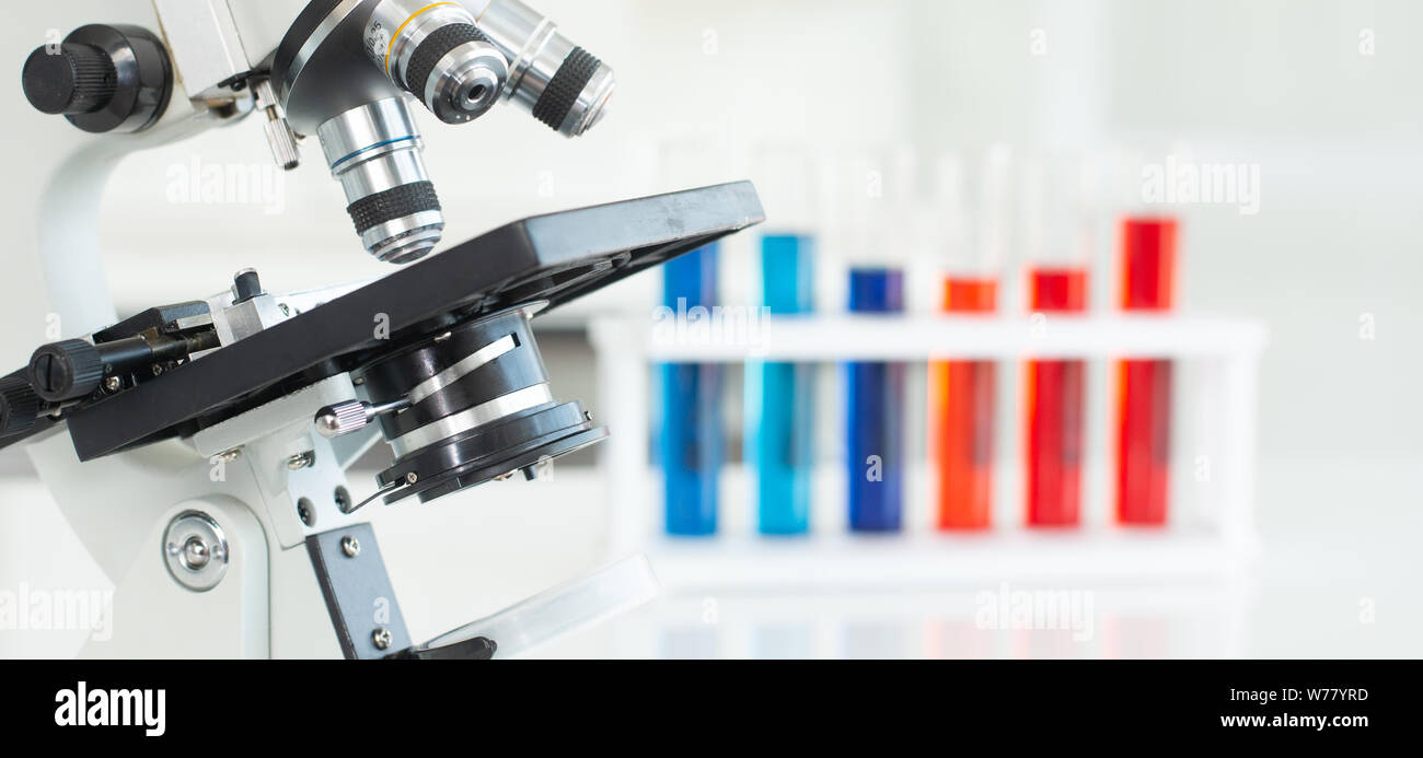 Microscope and glass tube in research laboratory concept Stock Photo ...