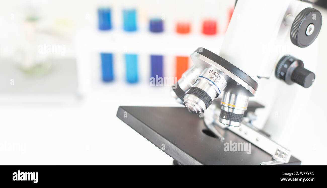 Microscope and glass tube in research laboratory concept Stock Photo ...