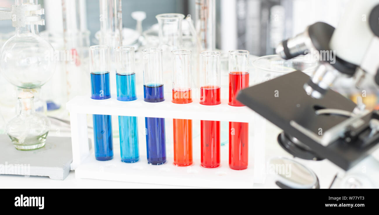 Microscope and glass tube in research laboratory concept Stock Photo ...
