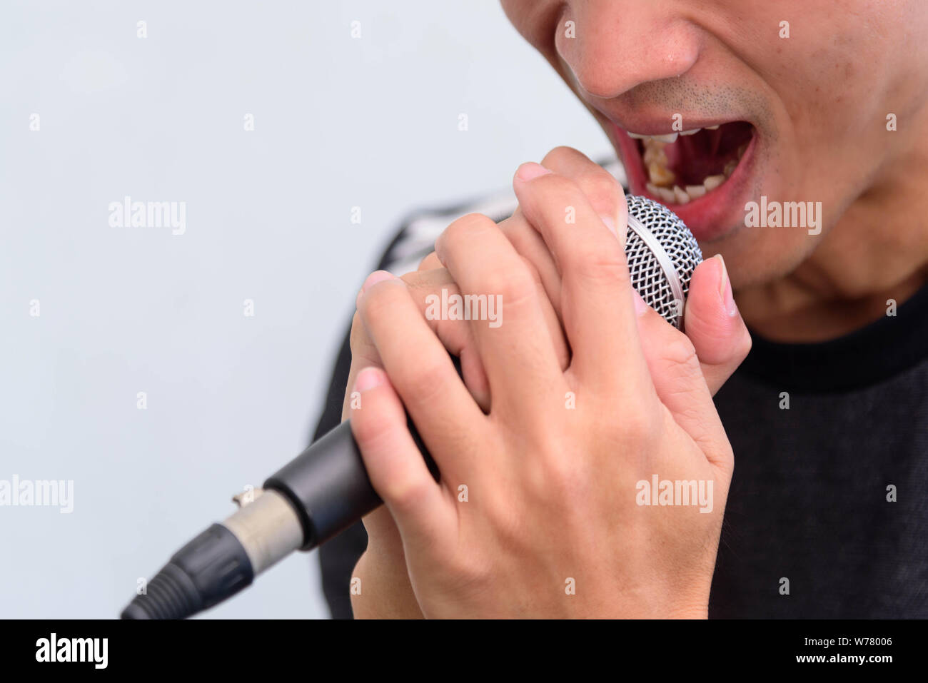 Holding Mic With Both Hands High Resolution Stock Photography and ...