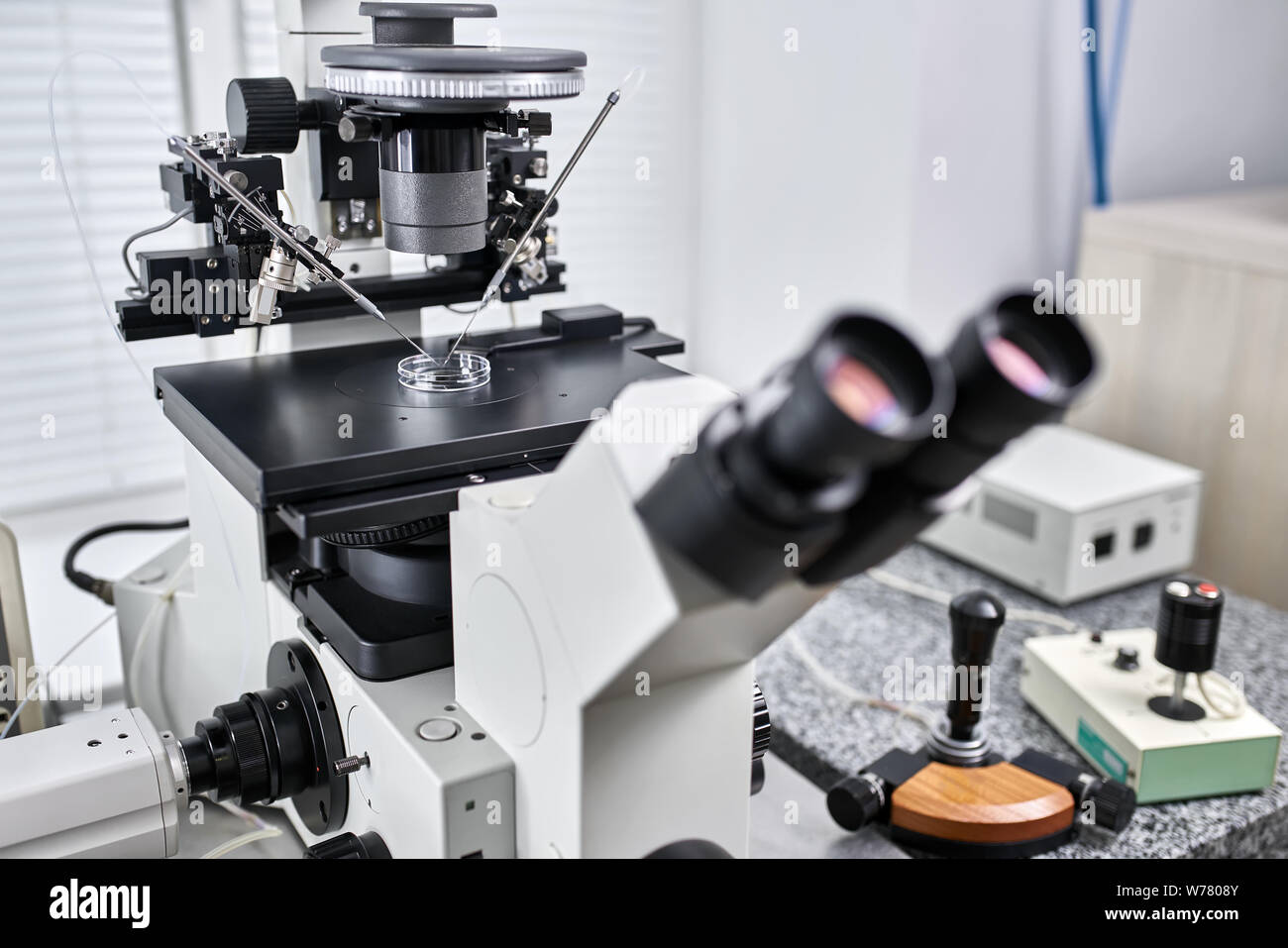 Hi-tech IVF micromanipulator with a microscope in the laboratory of the ...