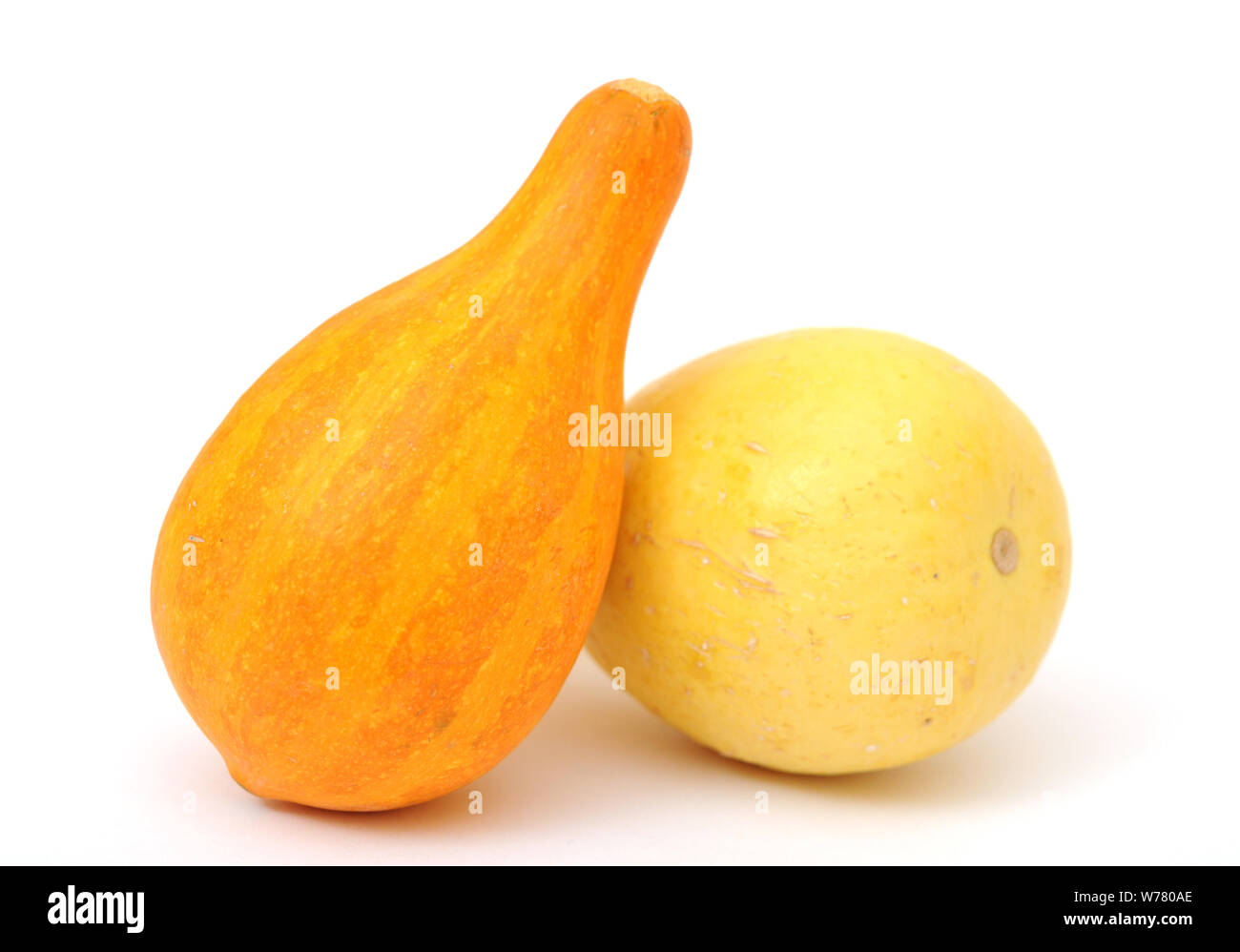 two yellow gourd on white background Stock Photo - Alamy
