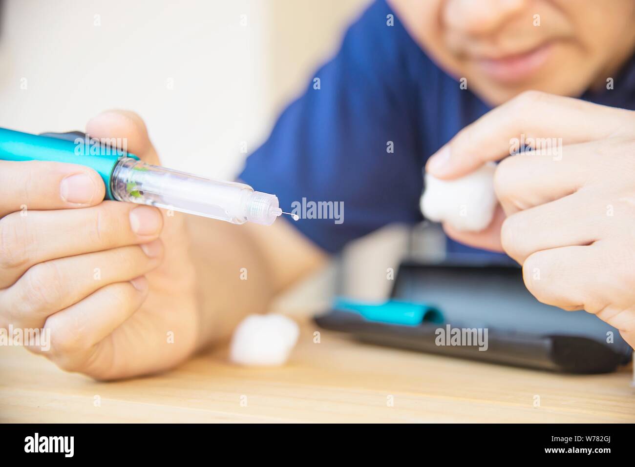 Man preparing insulin diabetic syringe for injection - people diabetic ...