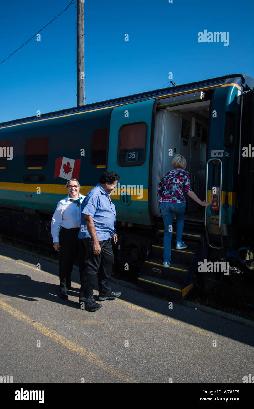 Lady train guard standing by the train from Toronto in Halifax Nova ...