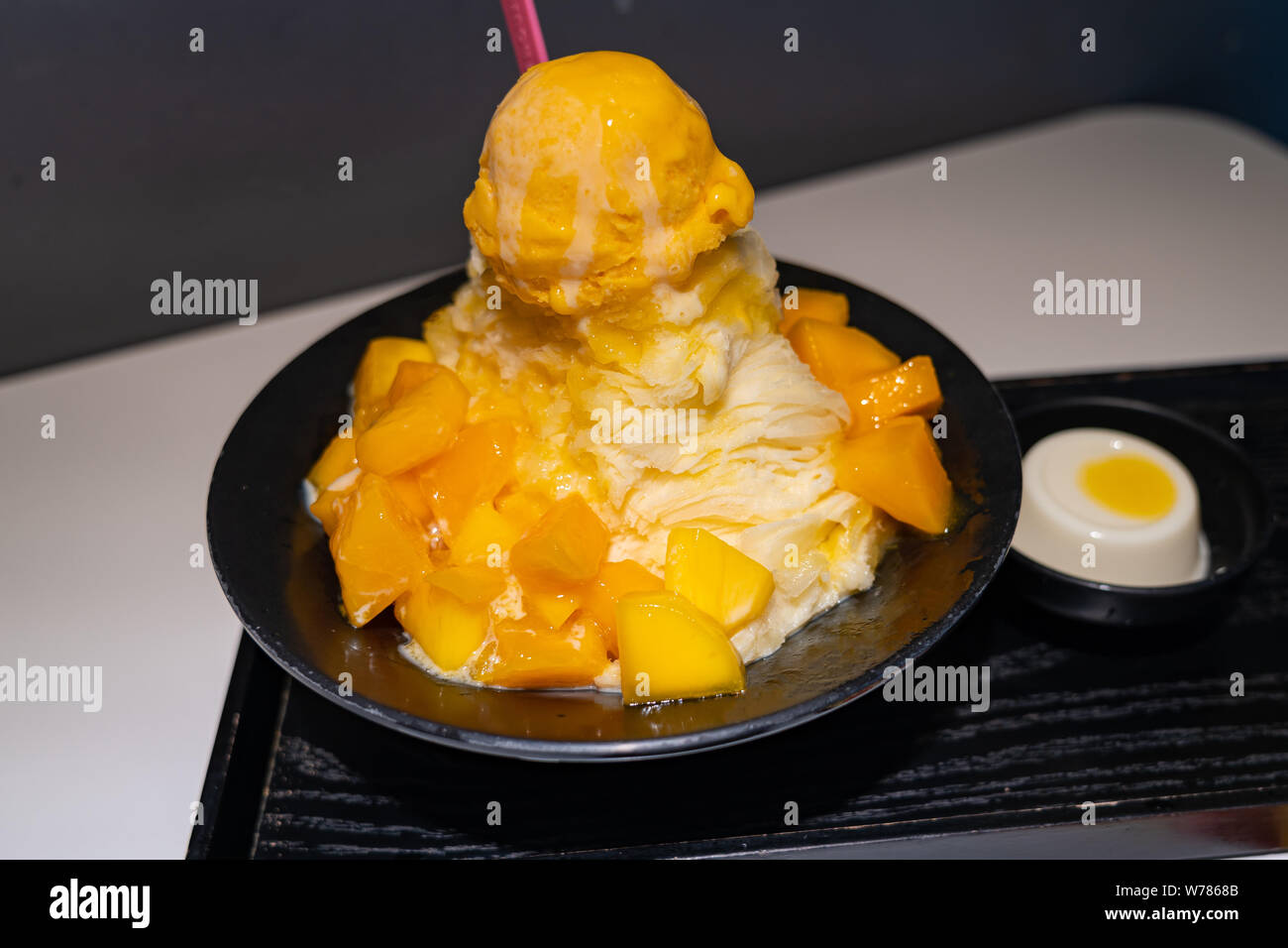 Mango fruit shaved ice and mango ice cream milk flavor serving with ...