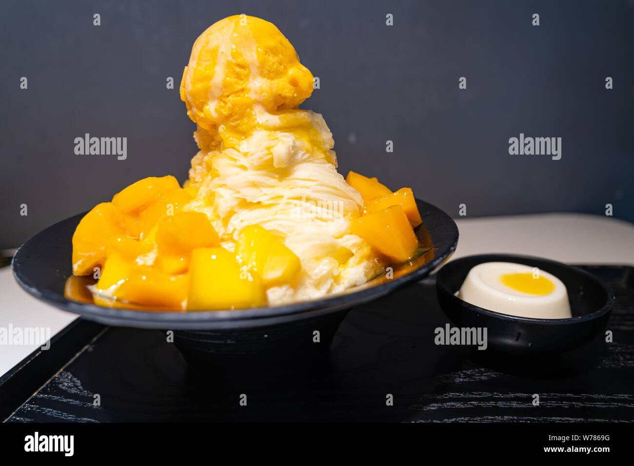 Mango fruit shaved ice and mango ice cream milk flavor serving with ...