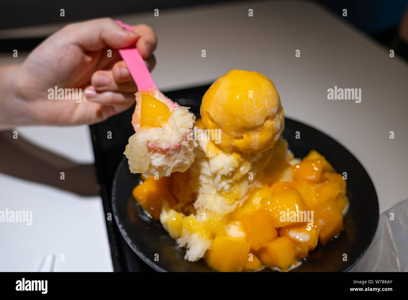 Mango fruit shaved ice and mango ice cream milk flavor serving with ...