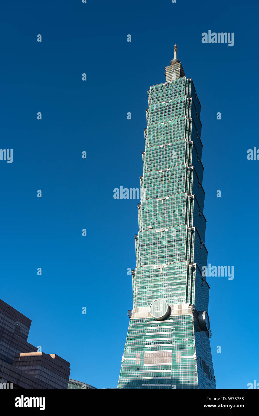 Taipei 101 skyscraper building close up view over dark blue sky ...