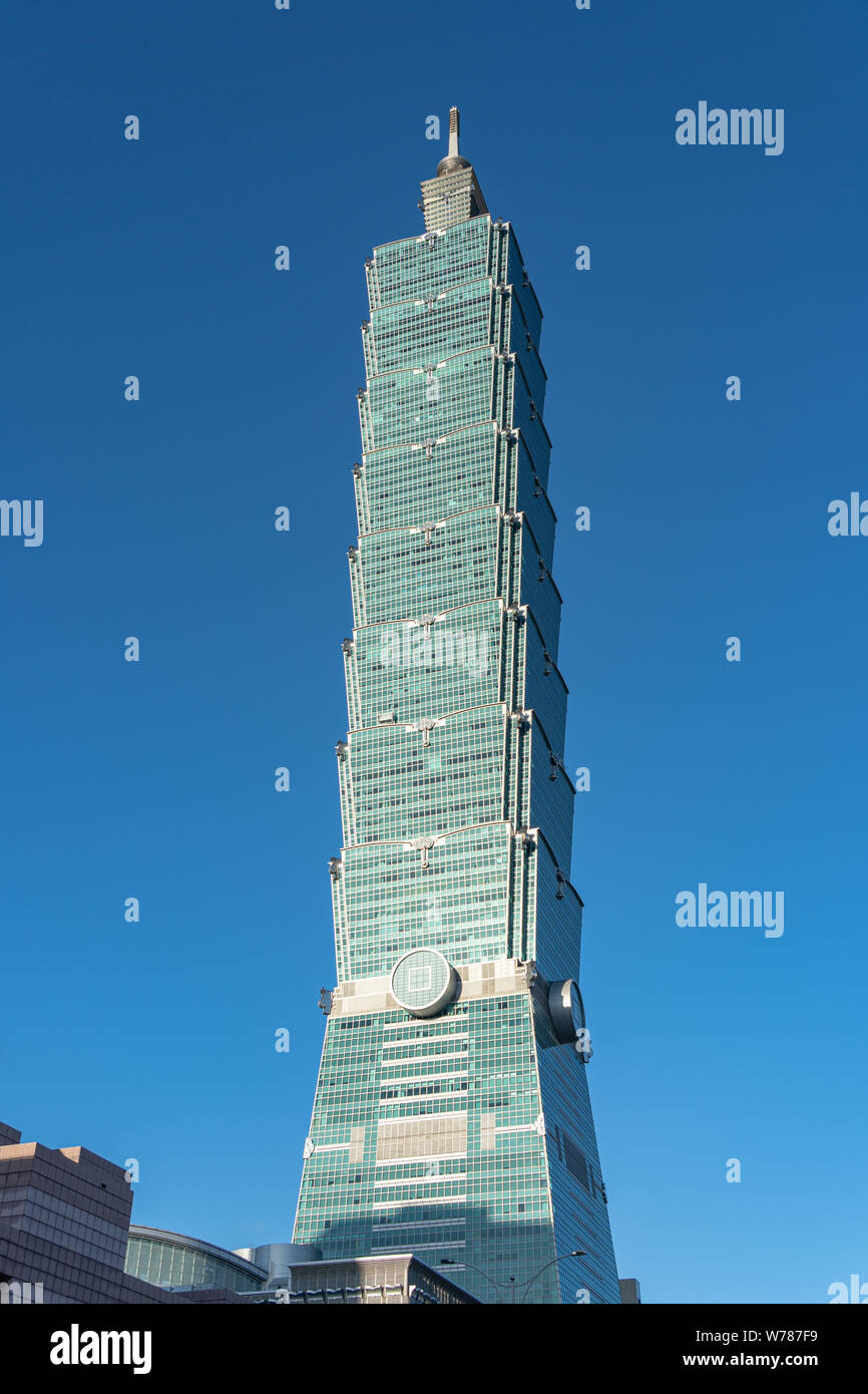Taipei 101 skyscraper building close up view over dark blue sky ...
