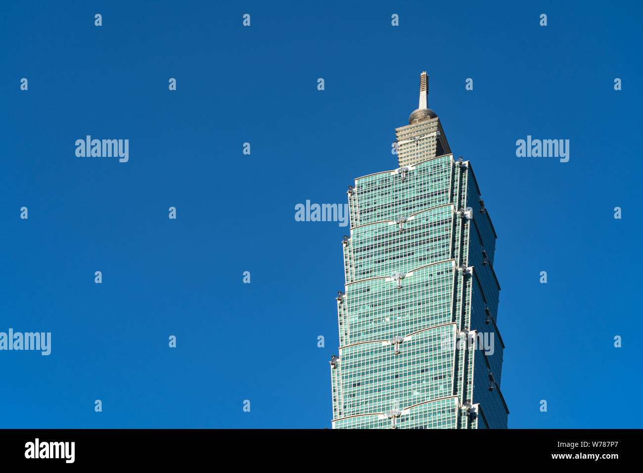 Taipei 101 skyscraper building close up view over dark blue sky ...