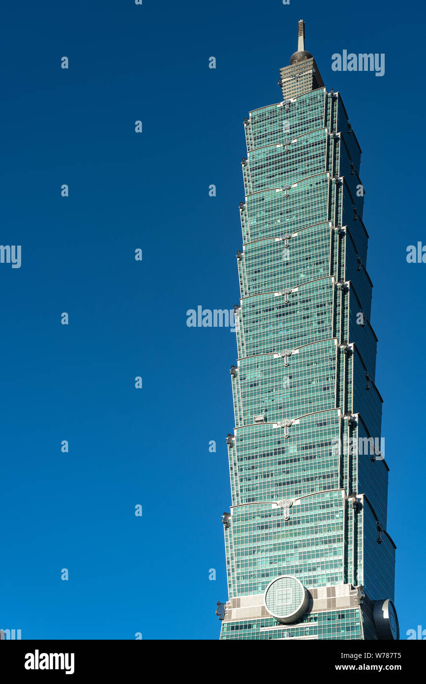 Taipei 101 skyscraper building close up view over dark blue sky ...