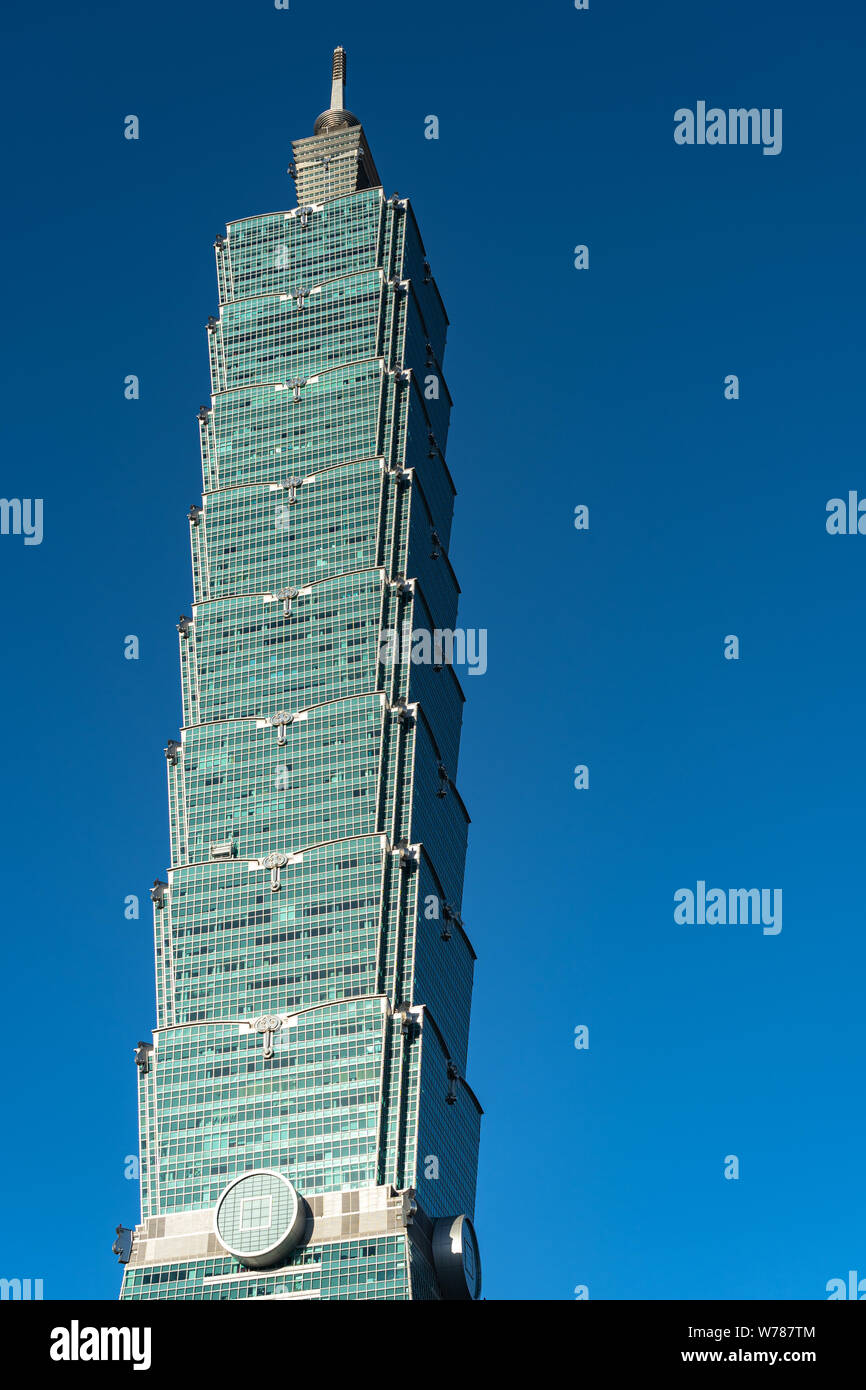 Taipei 101 skyscraper building close up view over dark blue sky ...