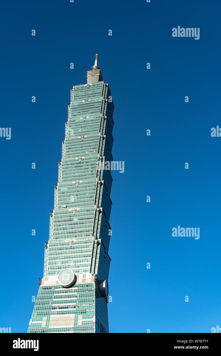 Taipei 101 skyscraper building close up view over dark blue sky ...