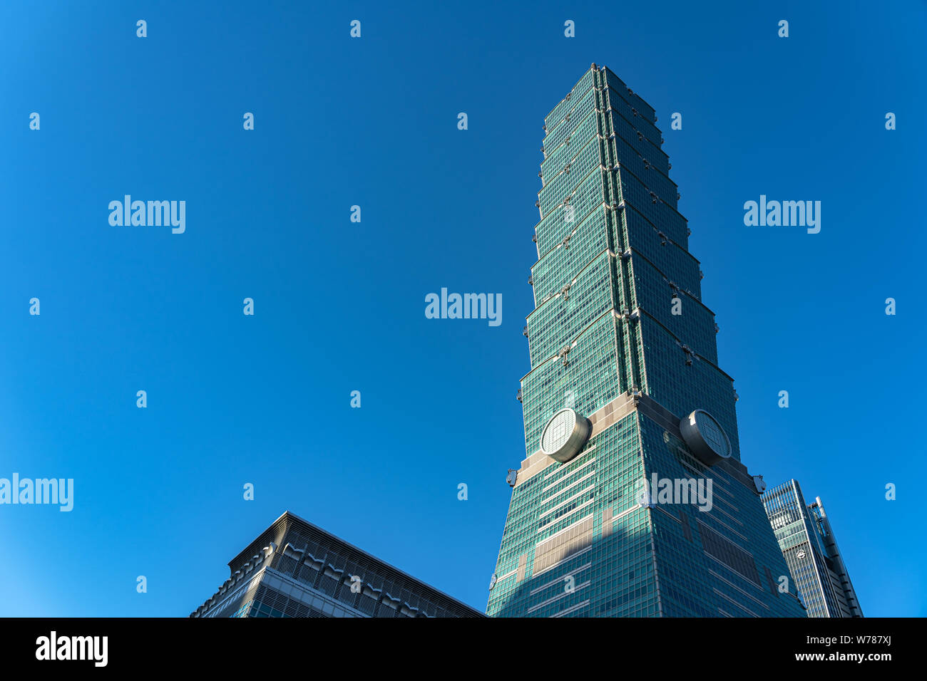 Taipei 101 skyscraper building close up view over dark blue sky ...
