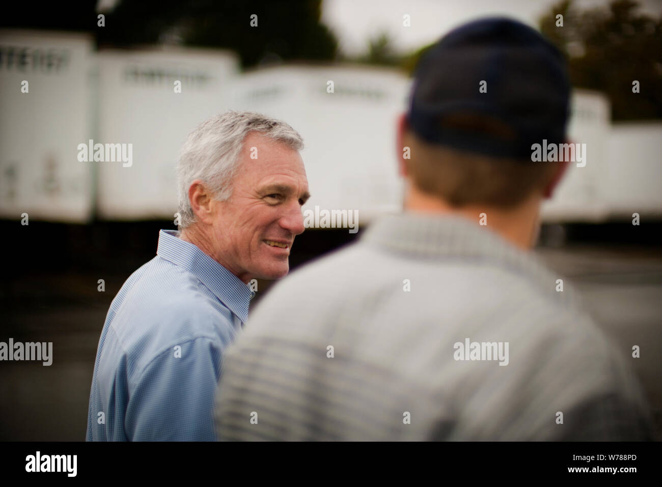 Two men talking together Stock Photo - Alamy