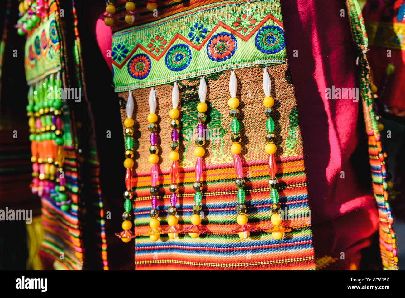 Detail of the colorful embroidery of a typical costume from the Andean ...
