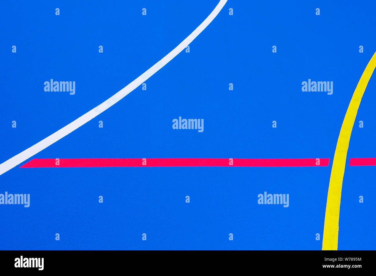 Red lines crossing a floor painted blue of intense color to use as a ...