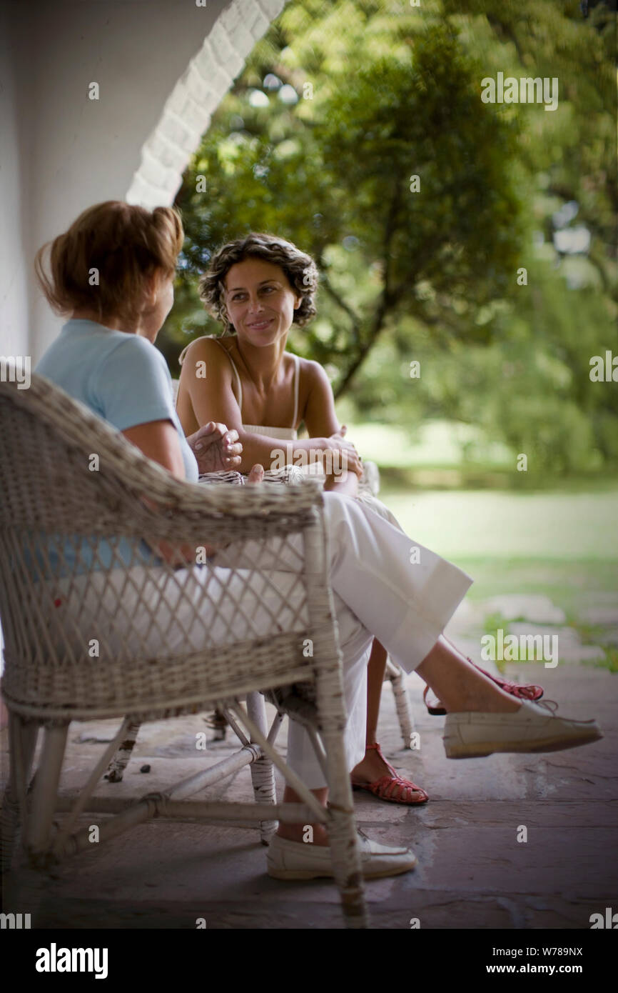 Portrait of two people engaged in a pleasant conversation Stock Photo ...