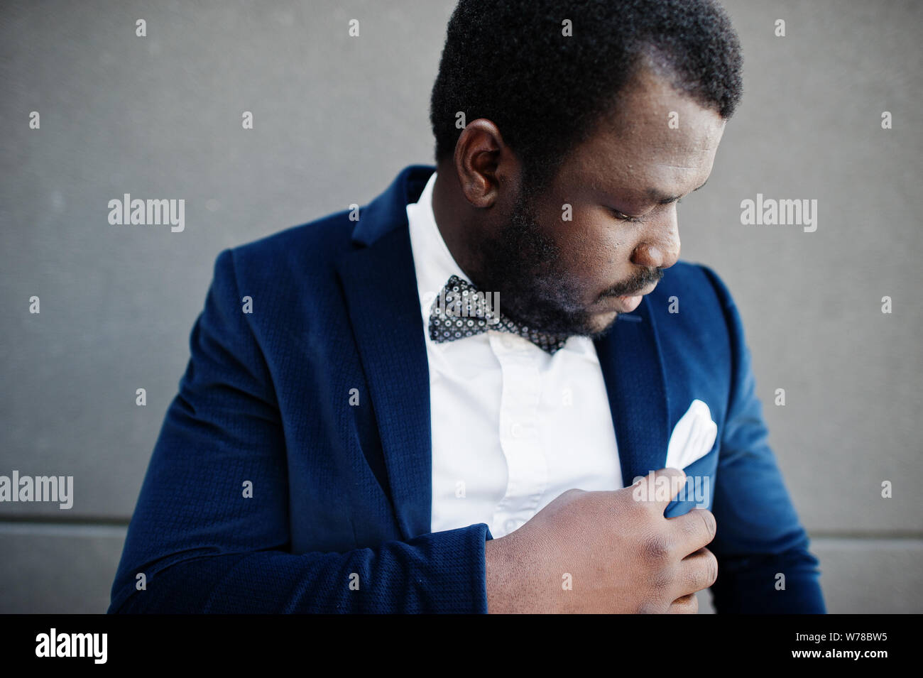 Handsome fashionable african american man in formal wear and bow tie ...
