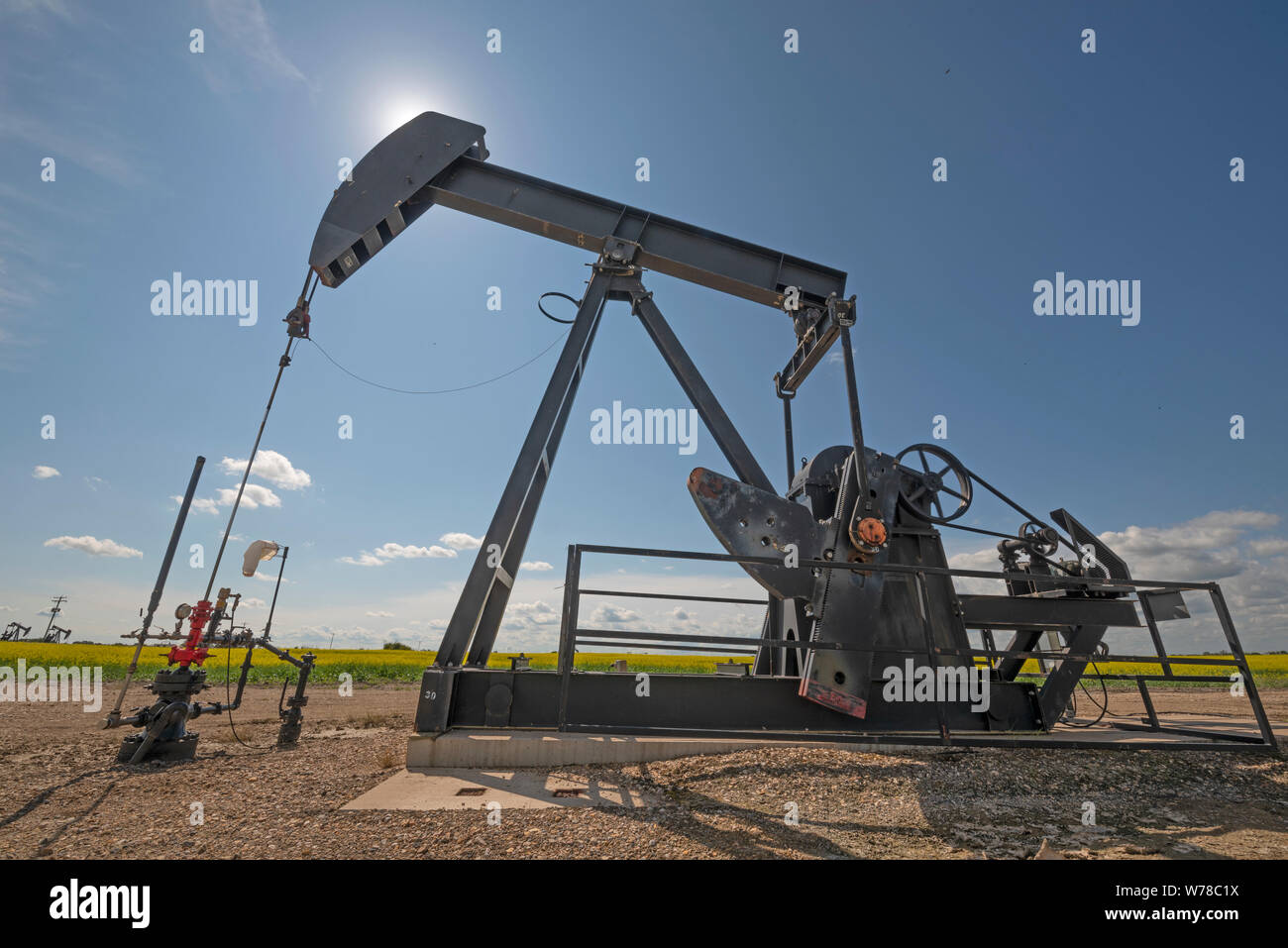 Pumpjack, or oil donkey in the open prairie in western Manitoba Stock ...