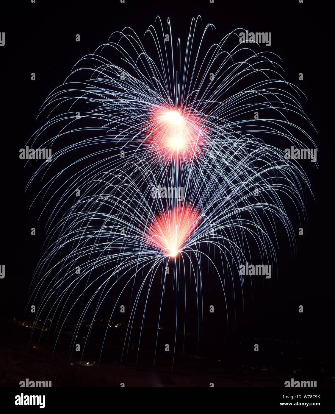Fireworks bursts, Blue spray red center Stock Photo - Alamy