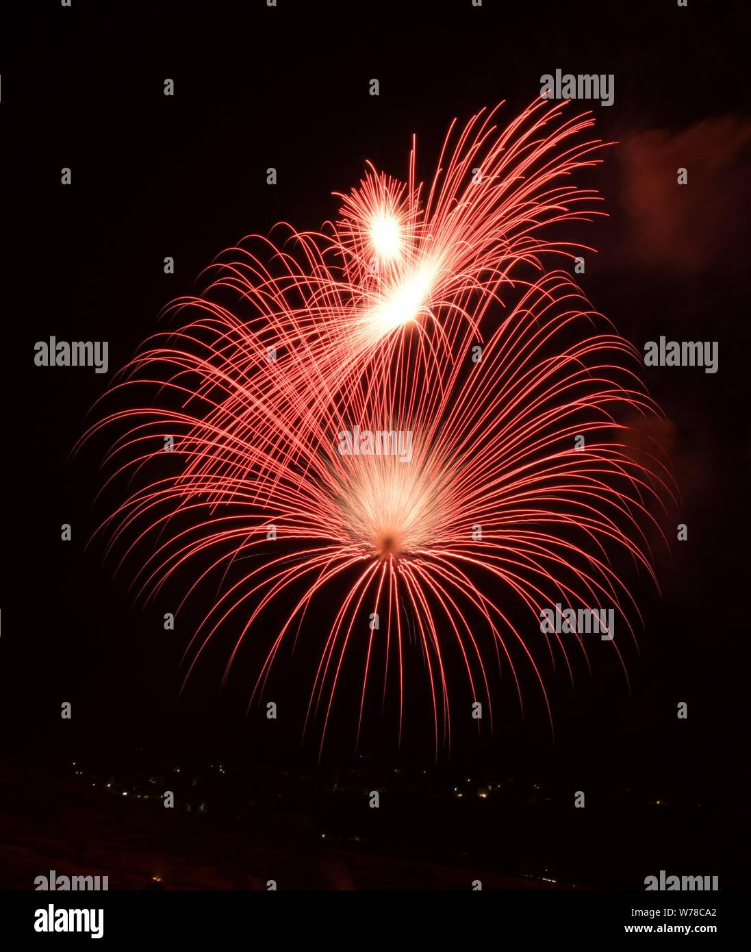 Fireworks bursts, three red sprays Stock Photo - Alamy