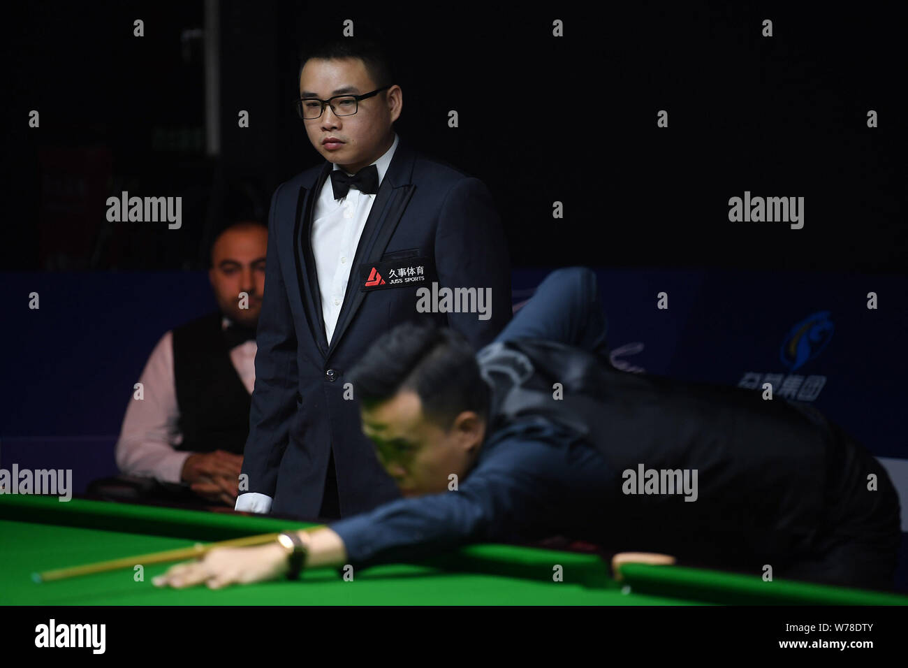 Marco Fu of Hong Kong plays a shot to Hossein Vafaei of Iran in their ...