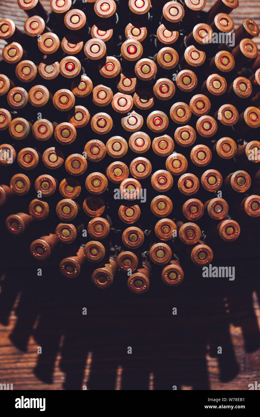 Bullets on a wooden background. Military concept Stock Photo - Alamy