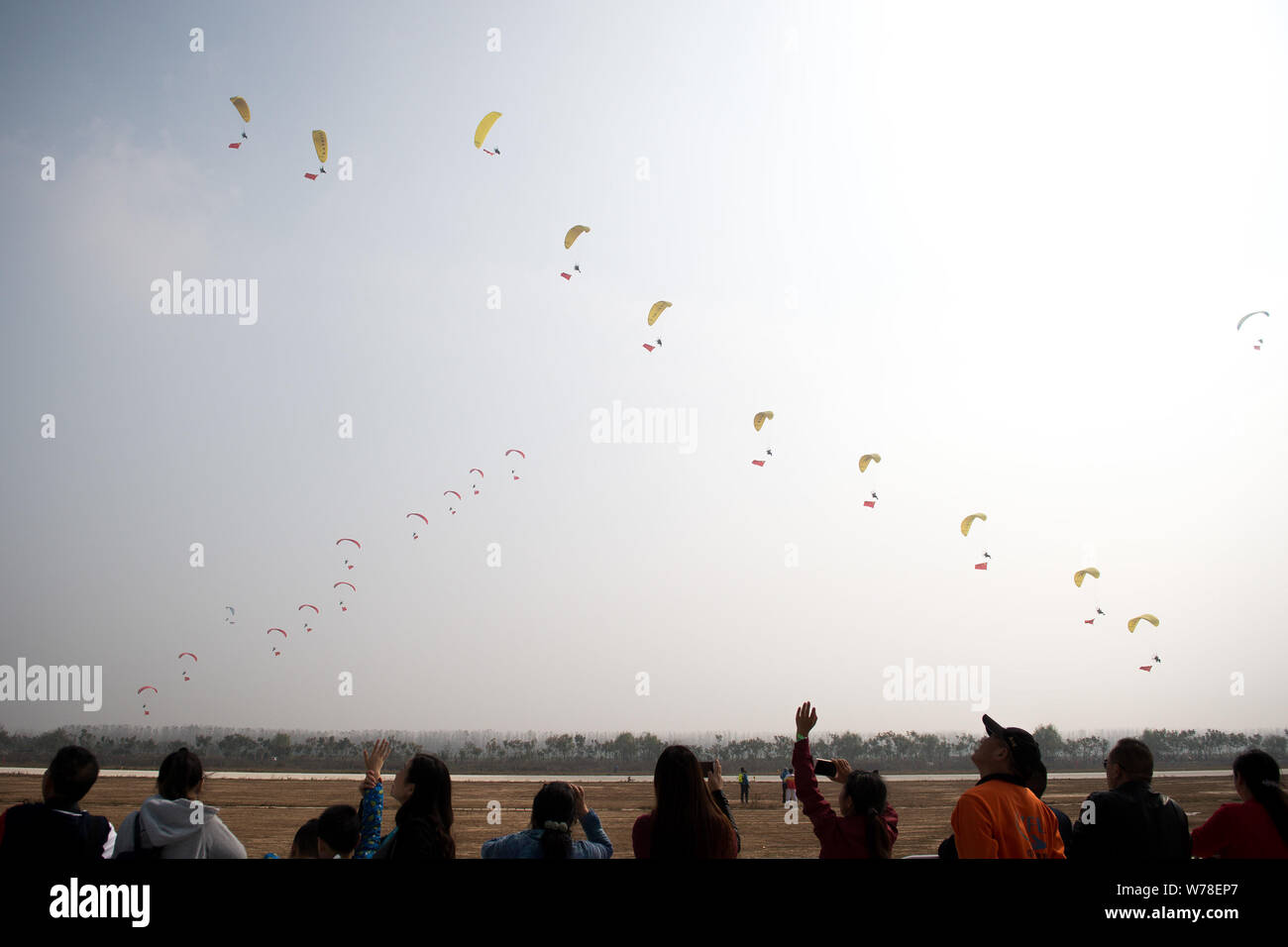 Local residents watch members from different countries performing ...