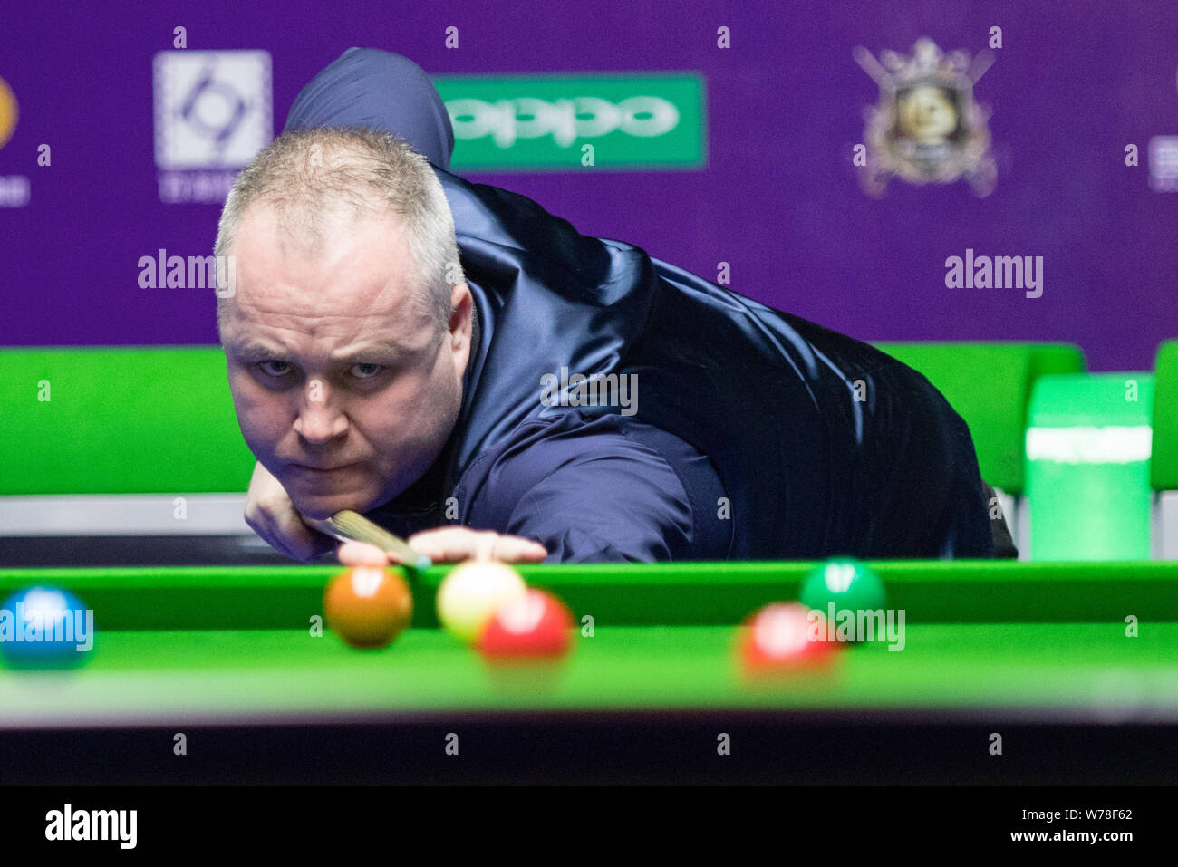 John Higgins of Scotland plays a shot to Mark Joyce of England in an ...