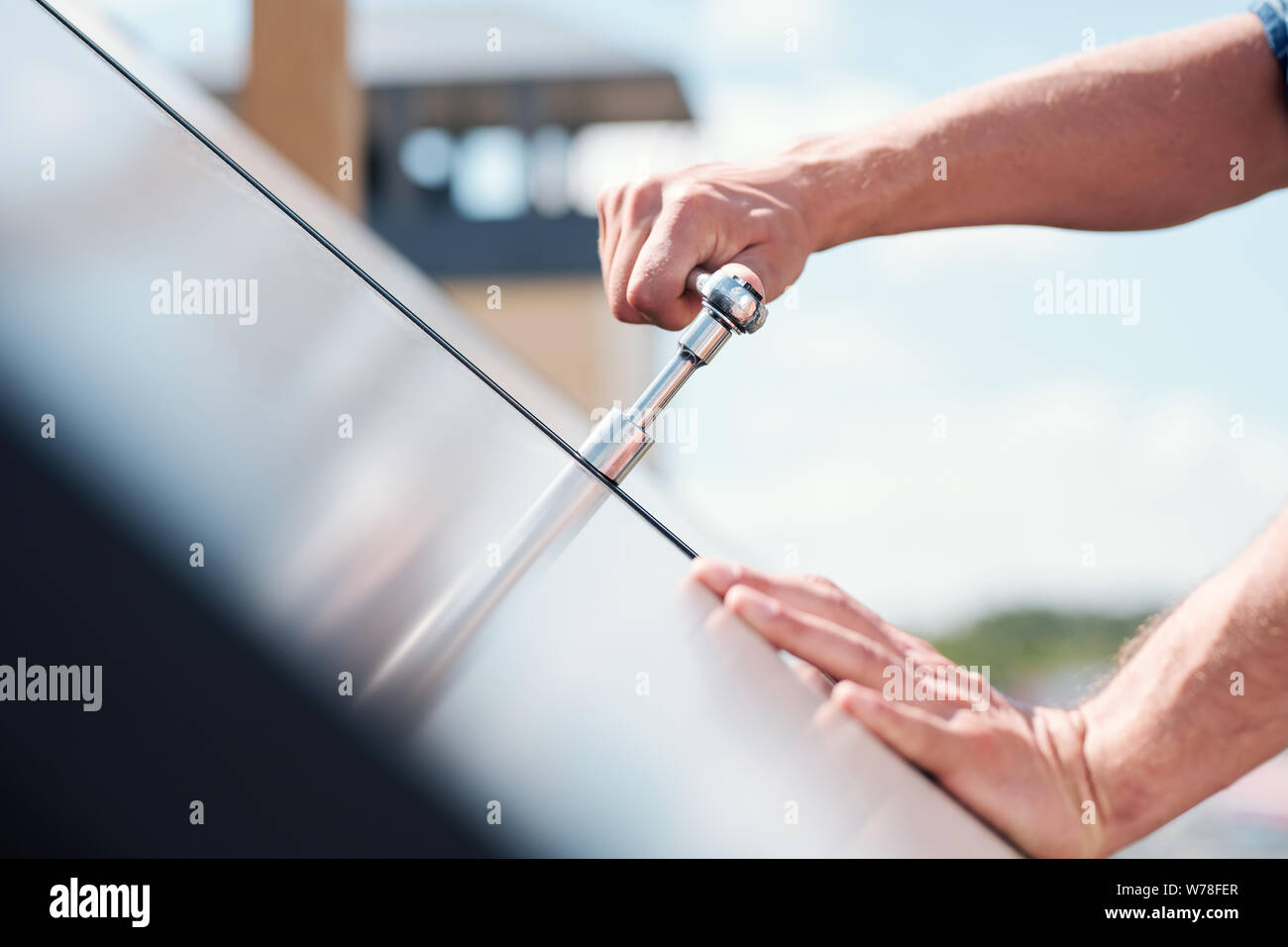 Hand of technician master turning steel handle or worktool Stock Photo ...
