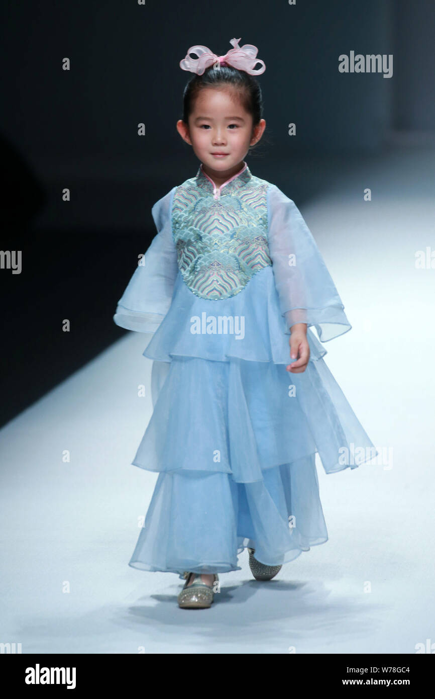 A model displays a new creation at the fashion show of Amelie Wang by ...