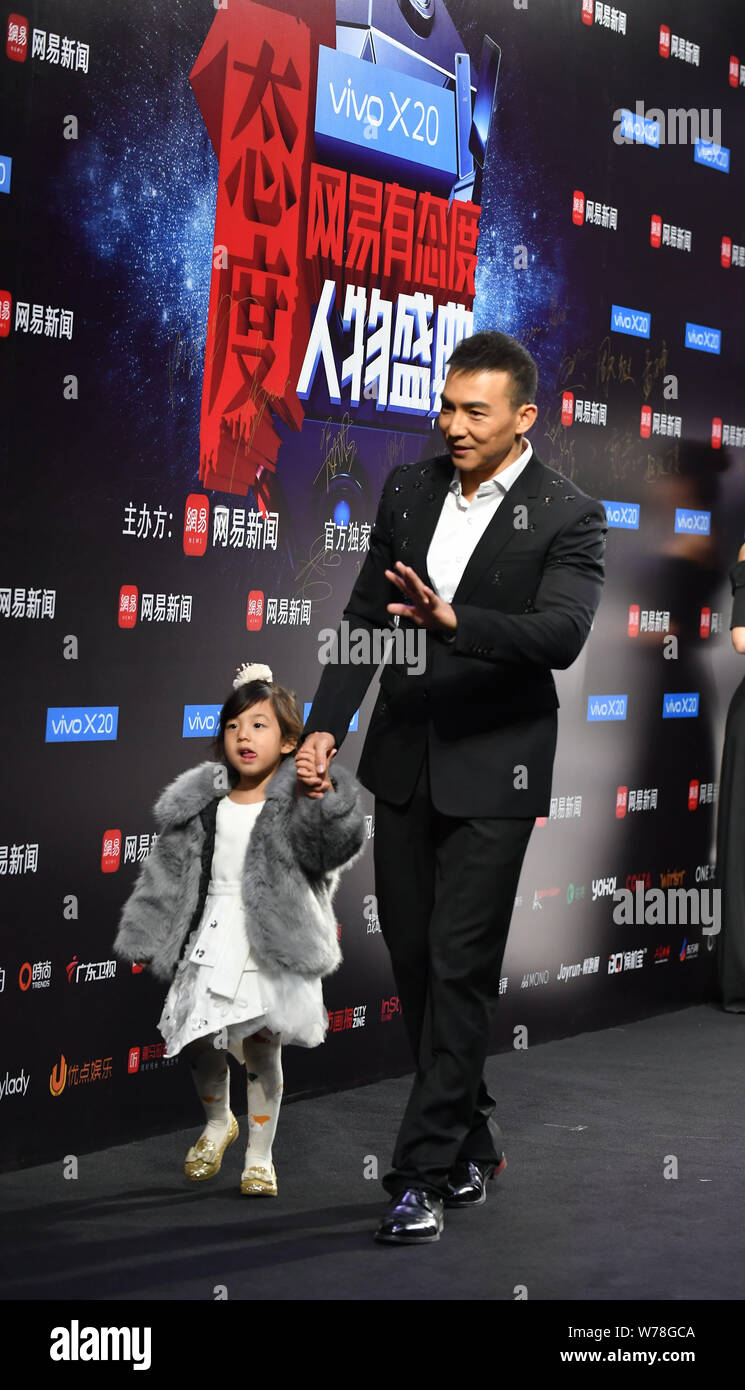 Taiwanese singer and actor Will Liu and his daughter Eve are pictured ...