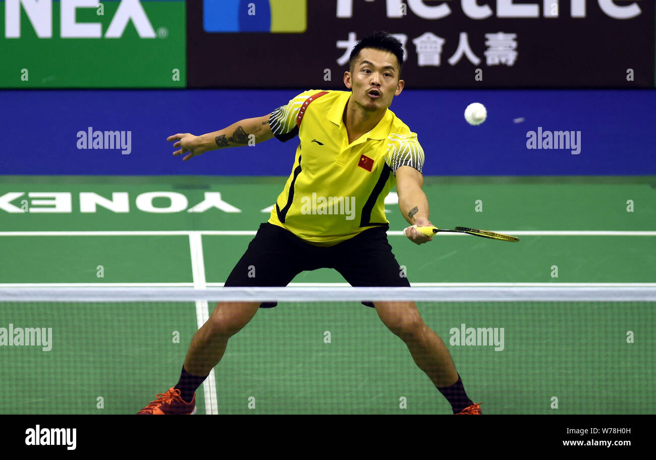 Lin Dan of China returns a shot to Shi Yuqi of China in their quarterfinal match of the men's ...