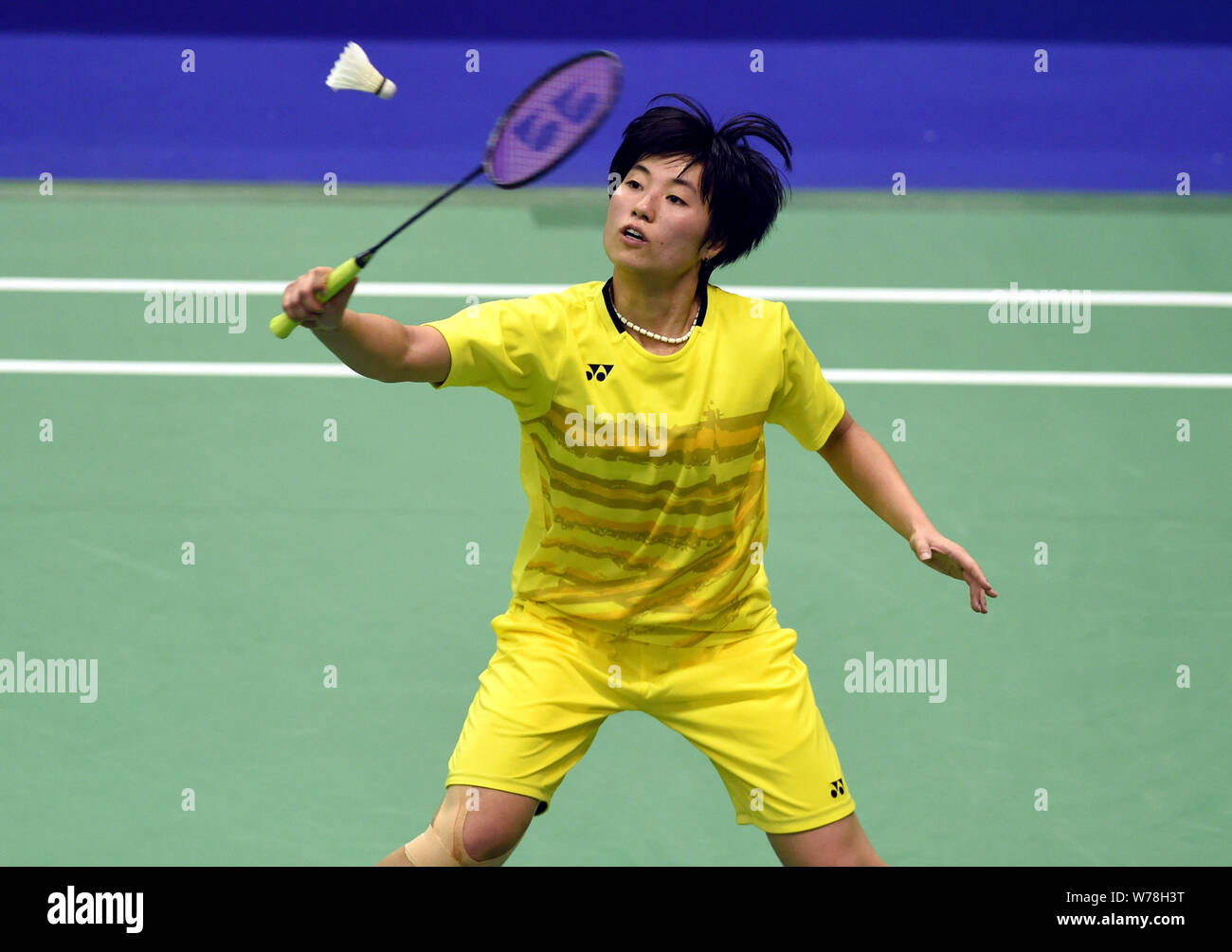 Yip Pui Yin of Hong Kong returns a shot to Sung Ji-hyun of South Korea ...