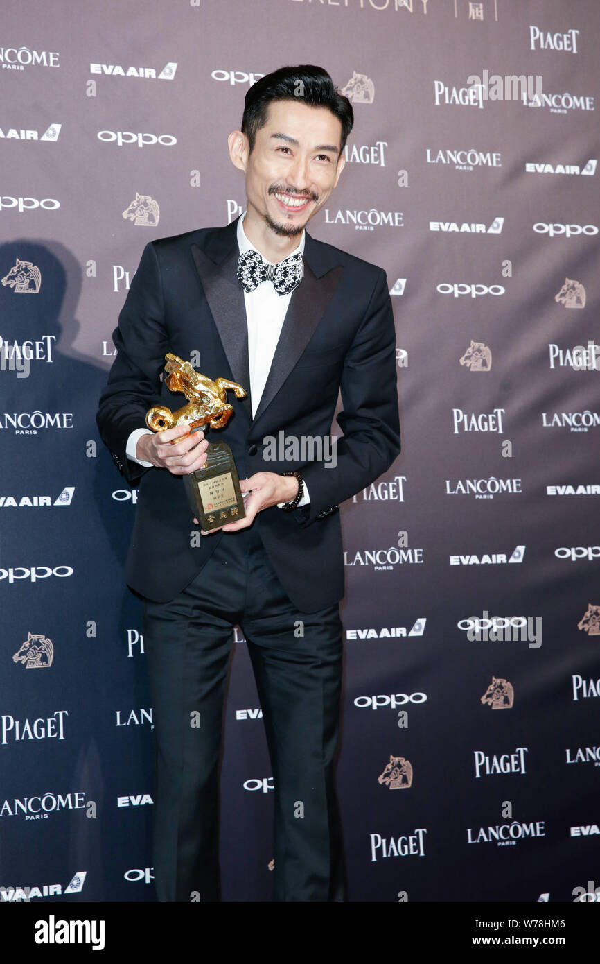 **TAIWAN OUT**Taiwanese actor Chen Chu-sheng poses with his trophy of ...