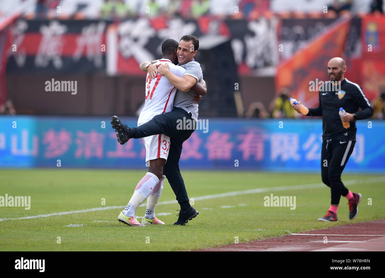 French football player Anthony Modeste, left, celebrates with head ...