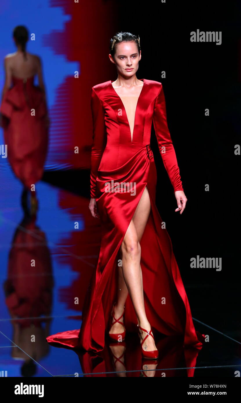 A model displays a new creation at the fashion show of Jusere by Yu ...