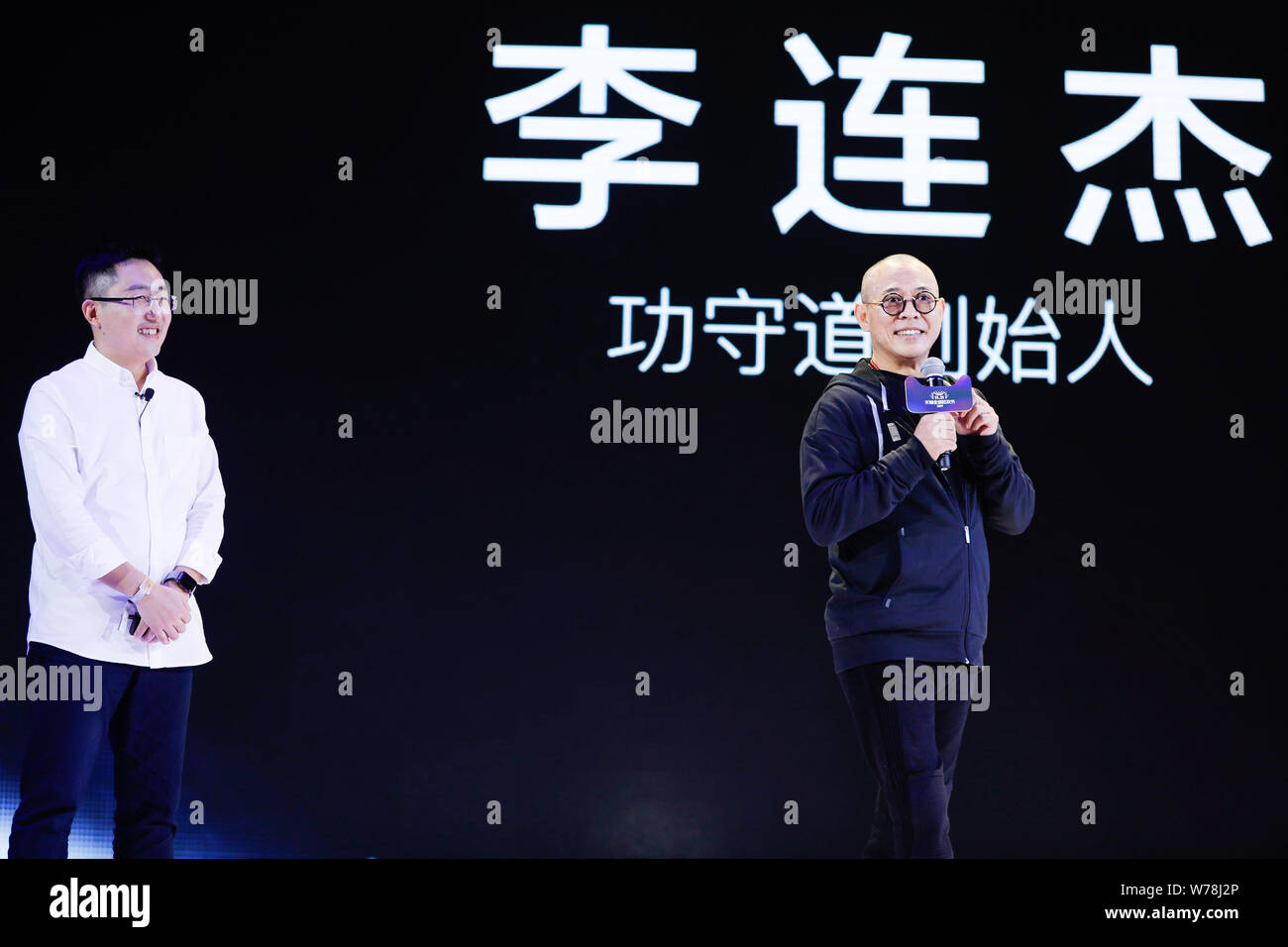 Chinese martial actor Jet Li, also known as Li Lianjie, right, attends ...
