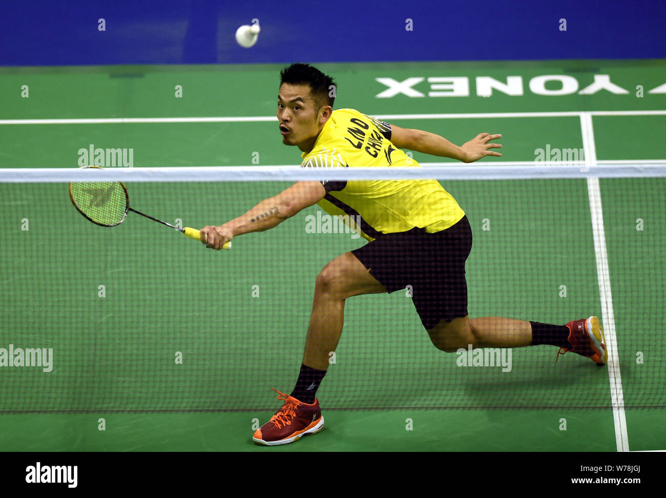 Lin Dan of China returns a shot to Shi Yuqi of China in their quarterfinal match of the men's ...
