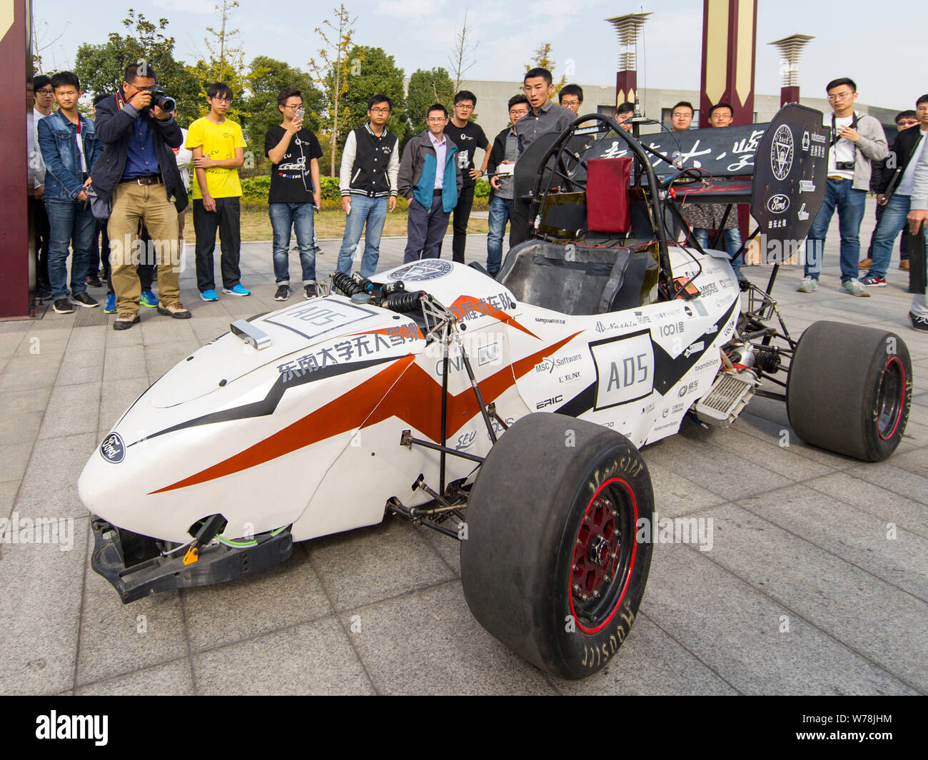 Students of Southeast University (SEU) Racing Team display the first ...
