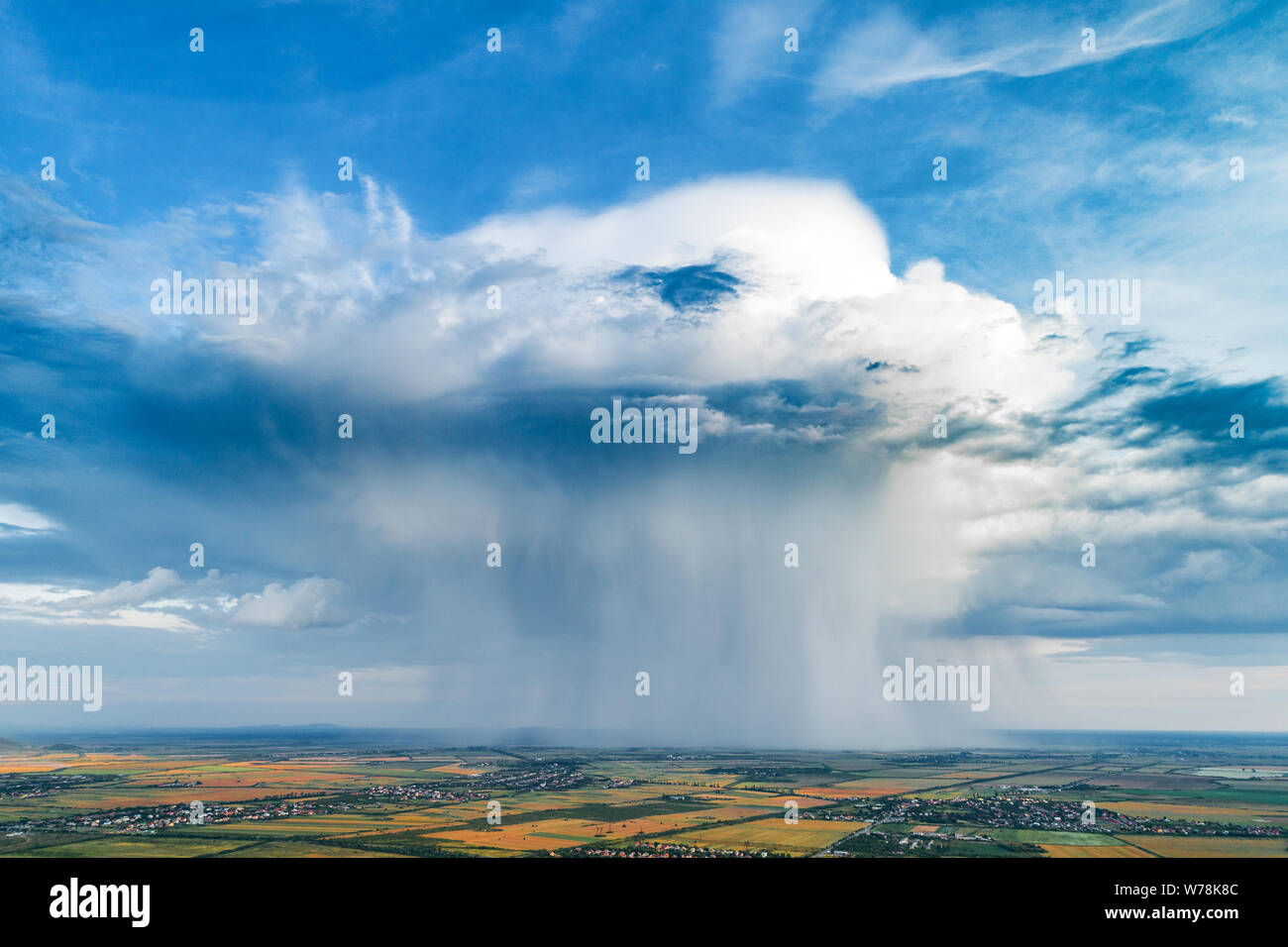 Beautiful rain cloud and rain over the fields Stock Photo - Alamy