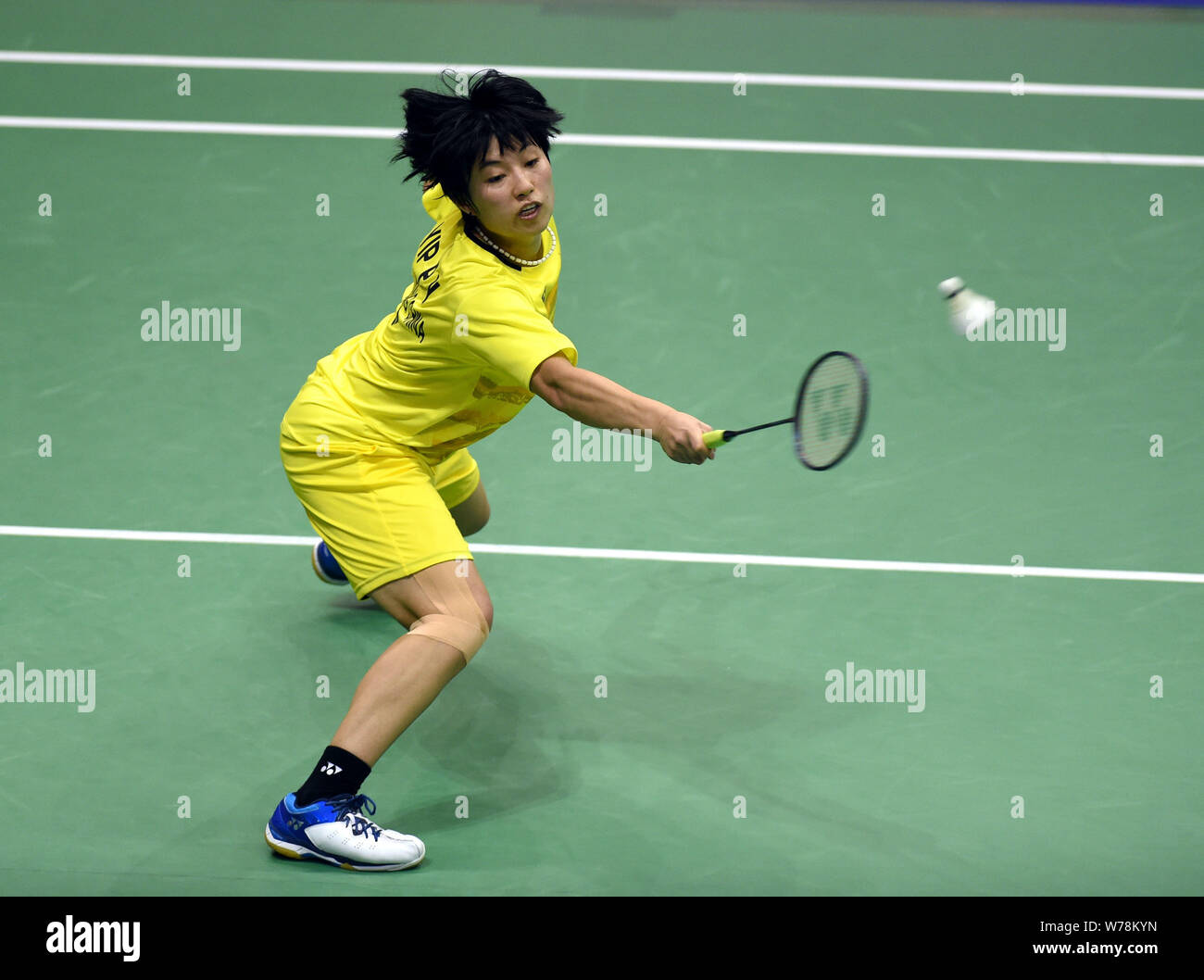 Yip Pui Yin of Hong Kong returns a shot to Sung Ji-hyun of South Korea ...