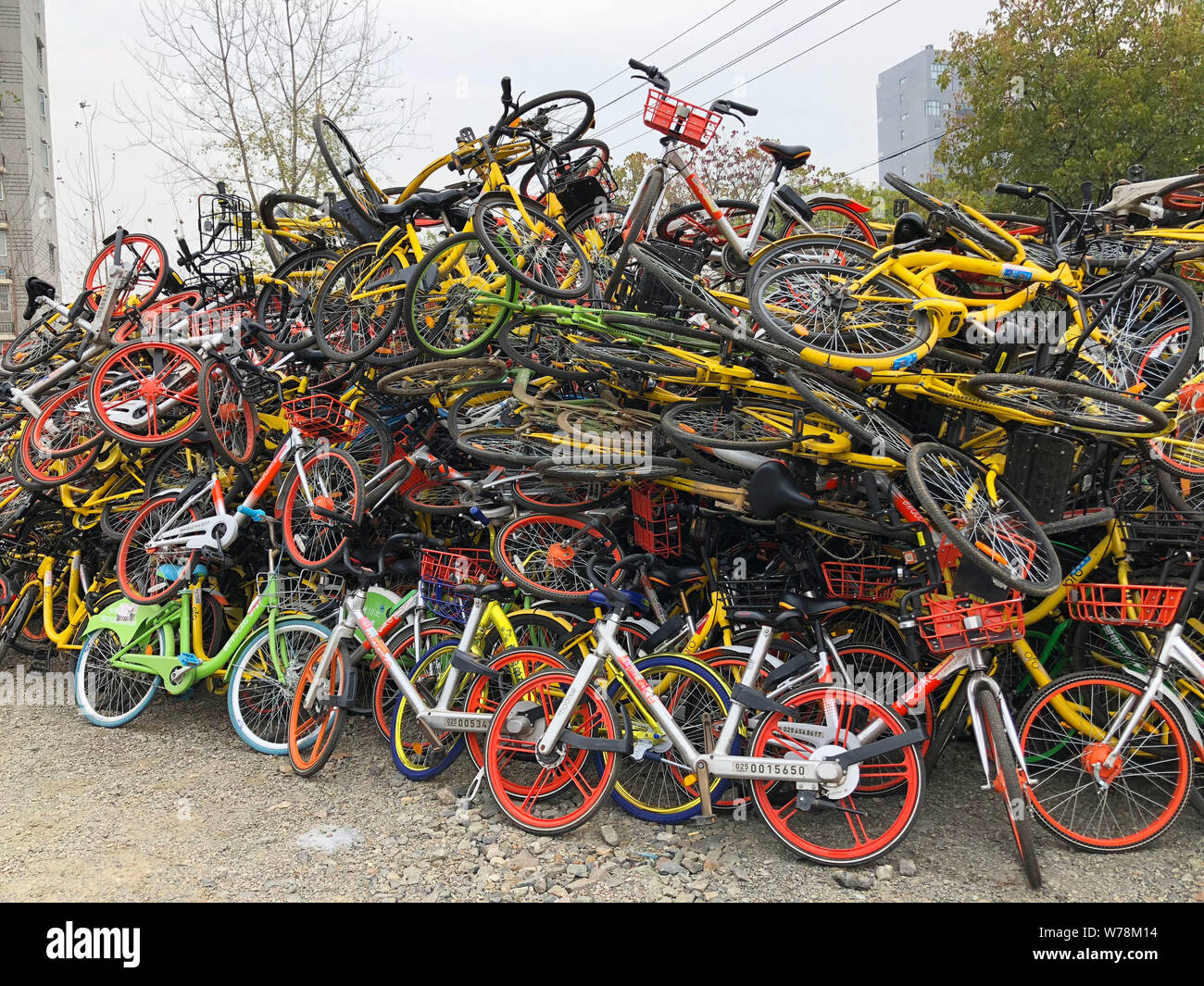 View of tens of thousands of abandoned shared bikes piled up at a ...