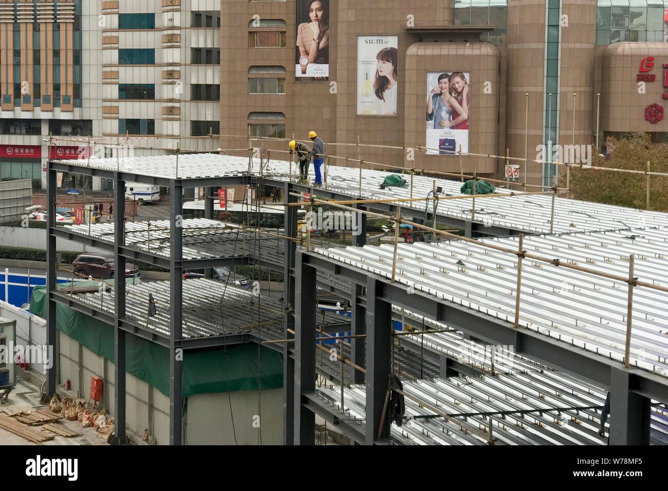 A ring-shaped pedestrian skywalk to connect malls is under construction ...